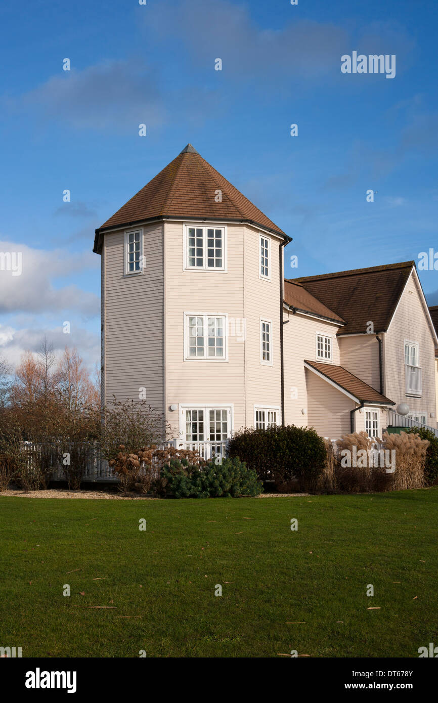 Timber clad holiday homes on a lakeside resort in the Cotswold Water ...
