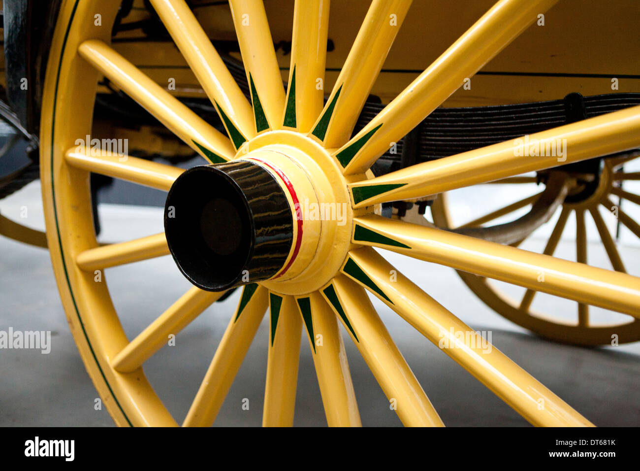 Wooden wheel from historical horse drawn bus on display at Brooklands ...