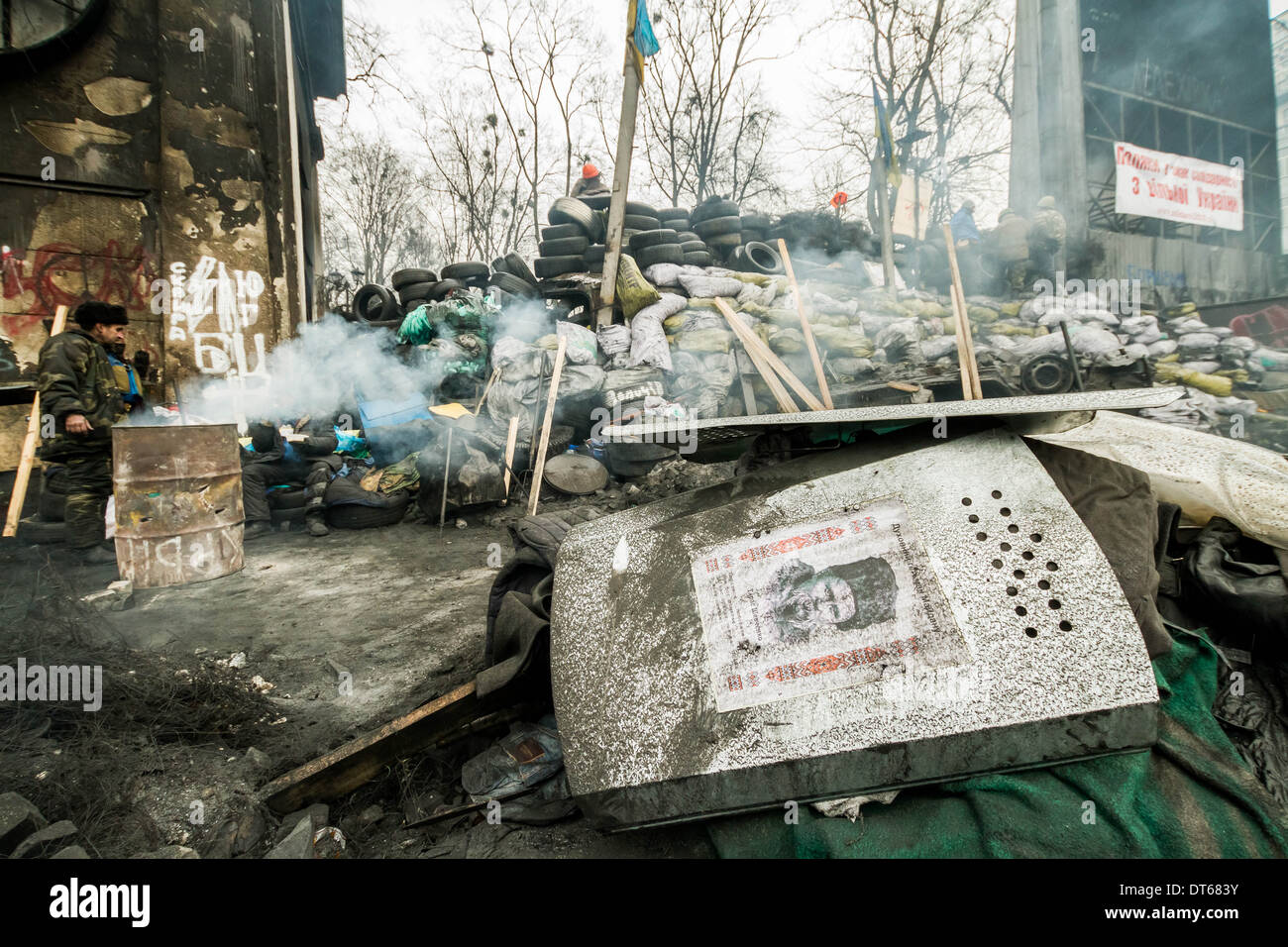 A Euromaidan protester's riot shield at the barricades with picture of ...