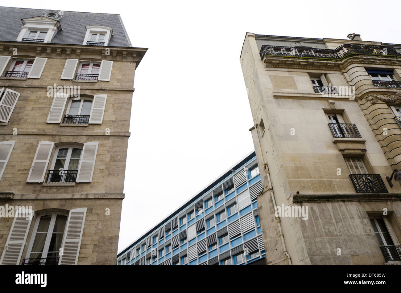 Facade of two neoclassical Paris buildings with a modern building ...