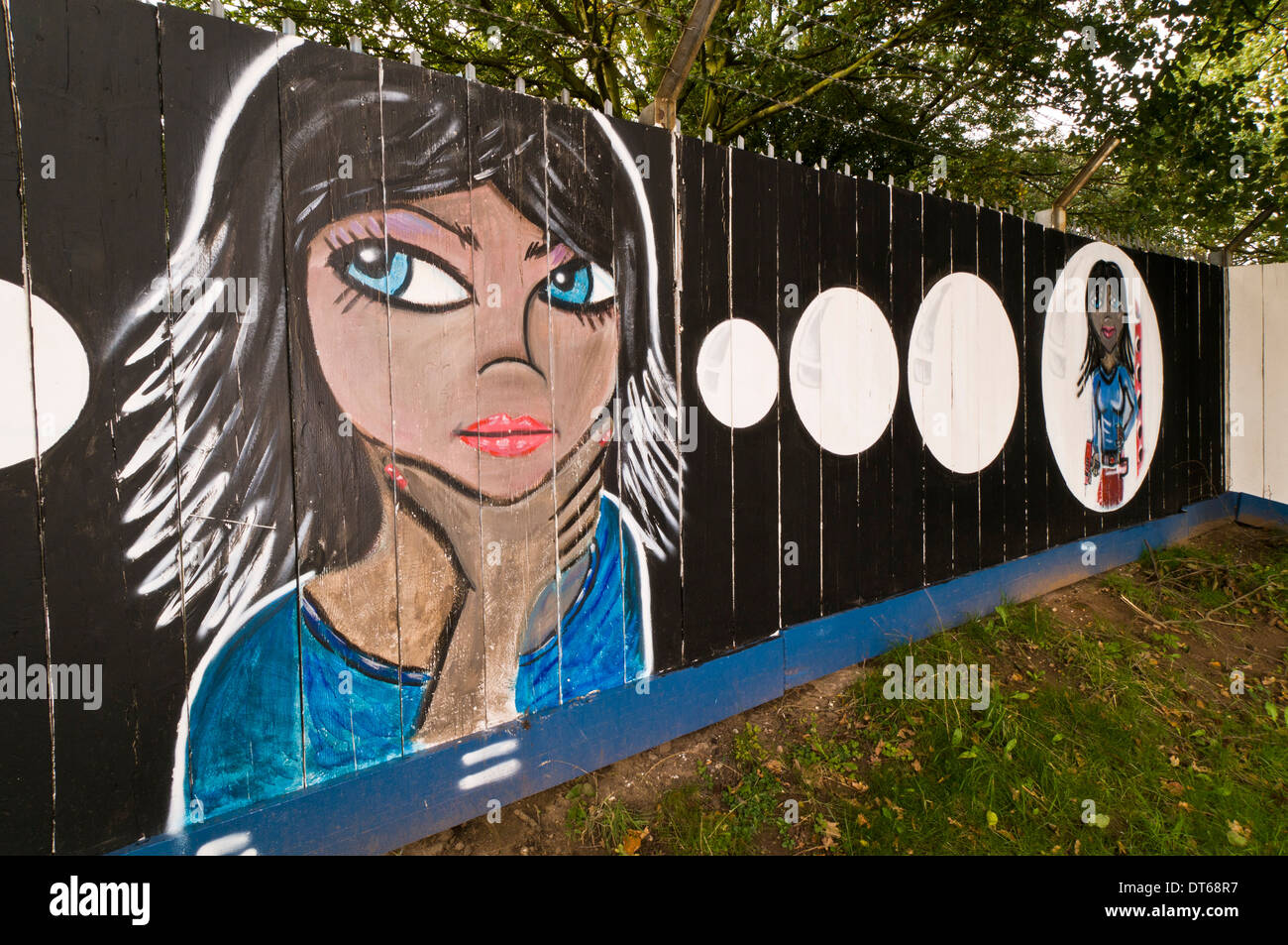 Graffiti mural on a fence Stock Photo - Alamy