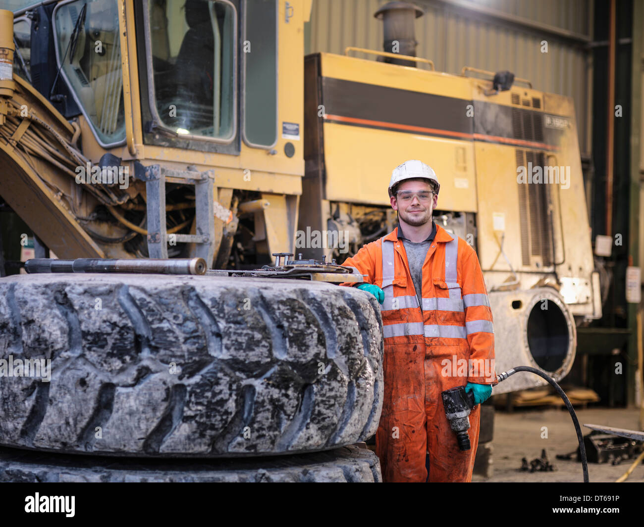 Engineer in suit holding helmet hi-res stock photography and images - Alamy