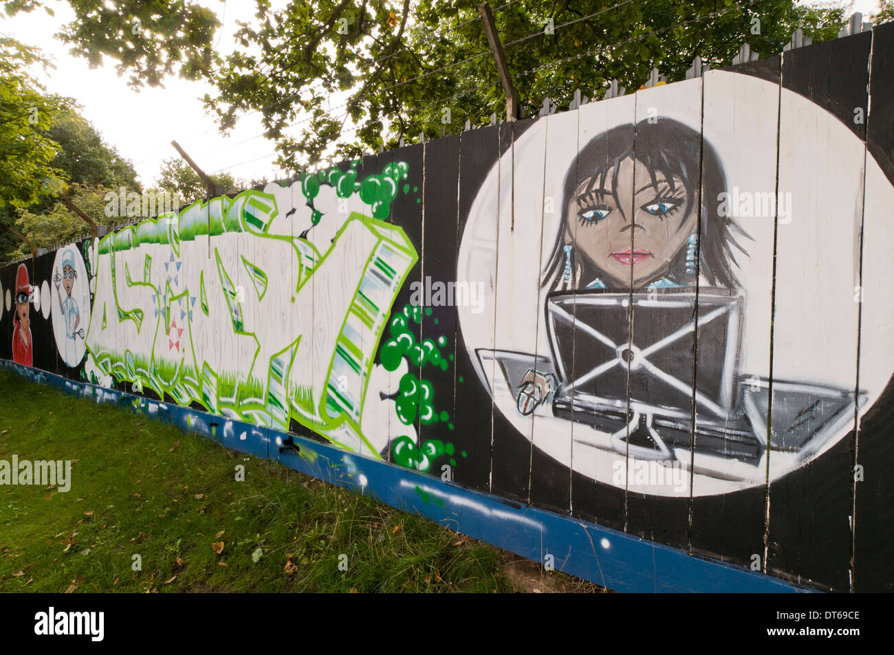 Graffiti mural on a fence Stock Photo - Alamy