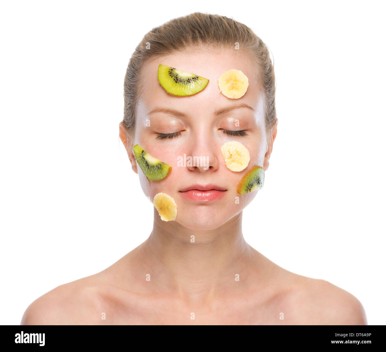 Portrait of relaxed young woman making fruits mask Stock Photo - Alamy