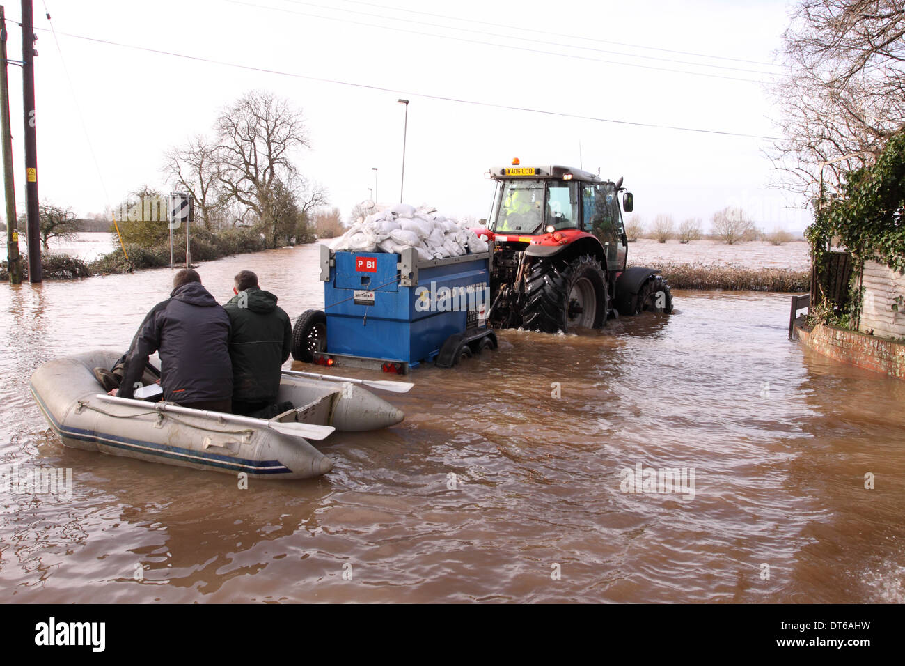 Flooding on the Somerset Levels at Burrowbridge a tractor towing a ...