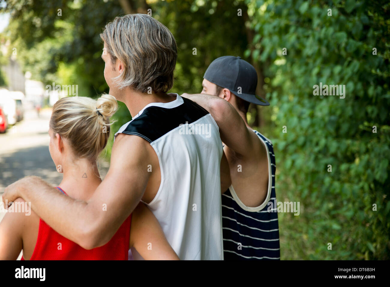 Group of runners watching and waiting at finish Stock Photo - Alamy
