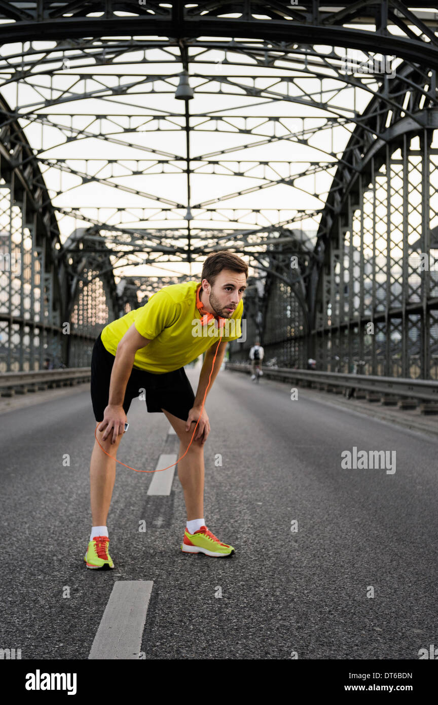 Young man headphones standing bridge hi-res stock photography and ...