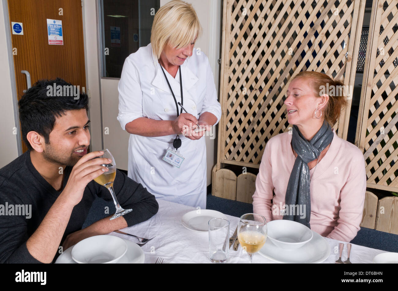 People ordering a meal at dining table hi-res stock photography and ...