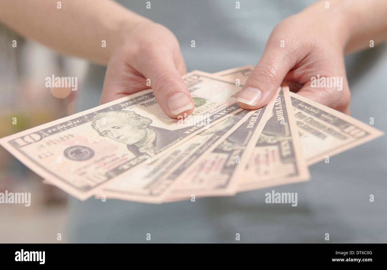 Female hand holding money notes hi-res stock photography and images - Alamy