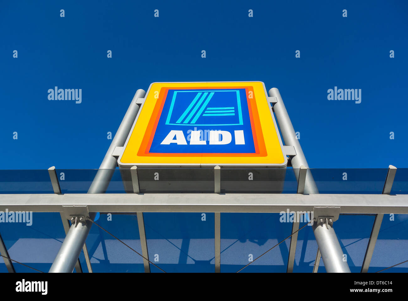 ALDI supermarket sign seen against a blue sky Stock Photo - Alamy