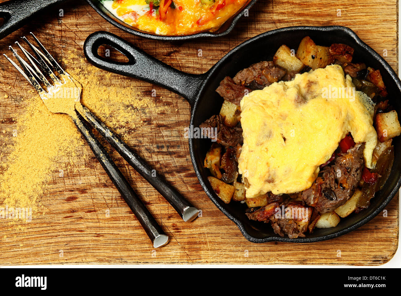 Texas Skillet Breakfast with Steak, Potato and Egg on Table Stock Photo ...