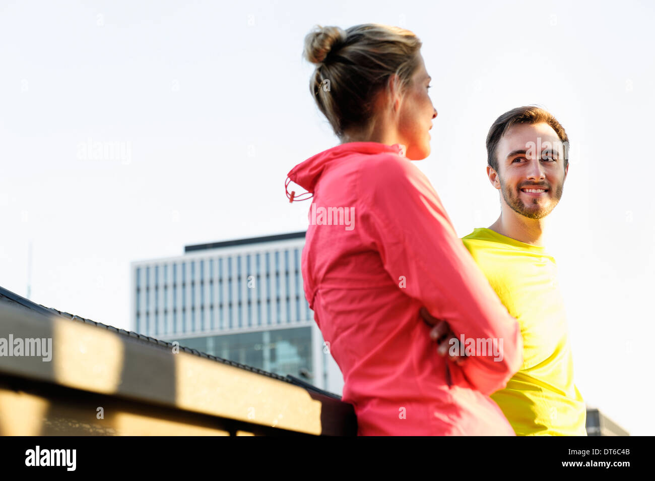 Couple standing side by side on bridge hi-res stock photography and ...