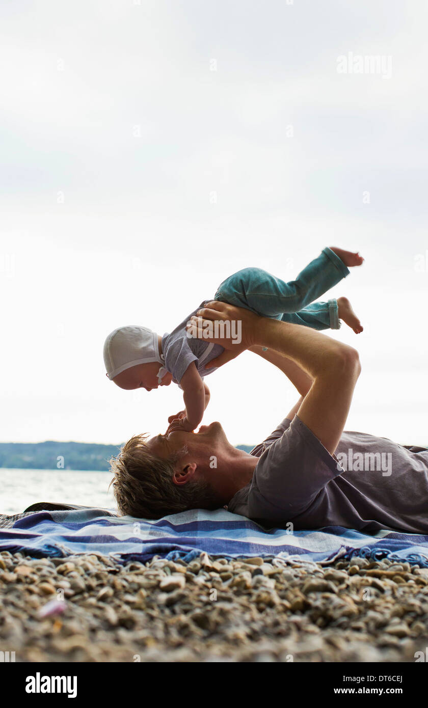 Father lifting baby daughter Stock Photo - Alamy