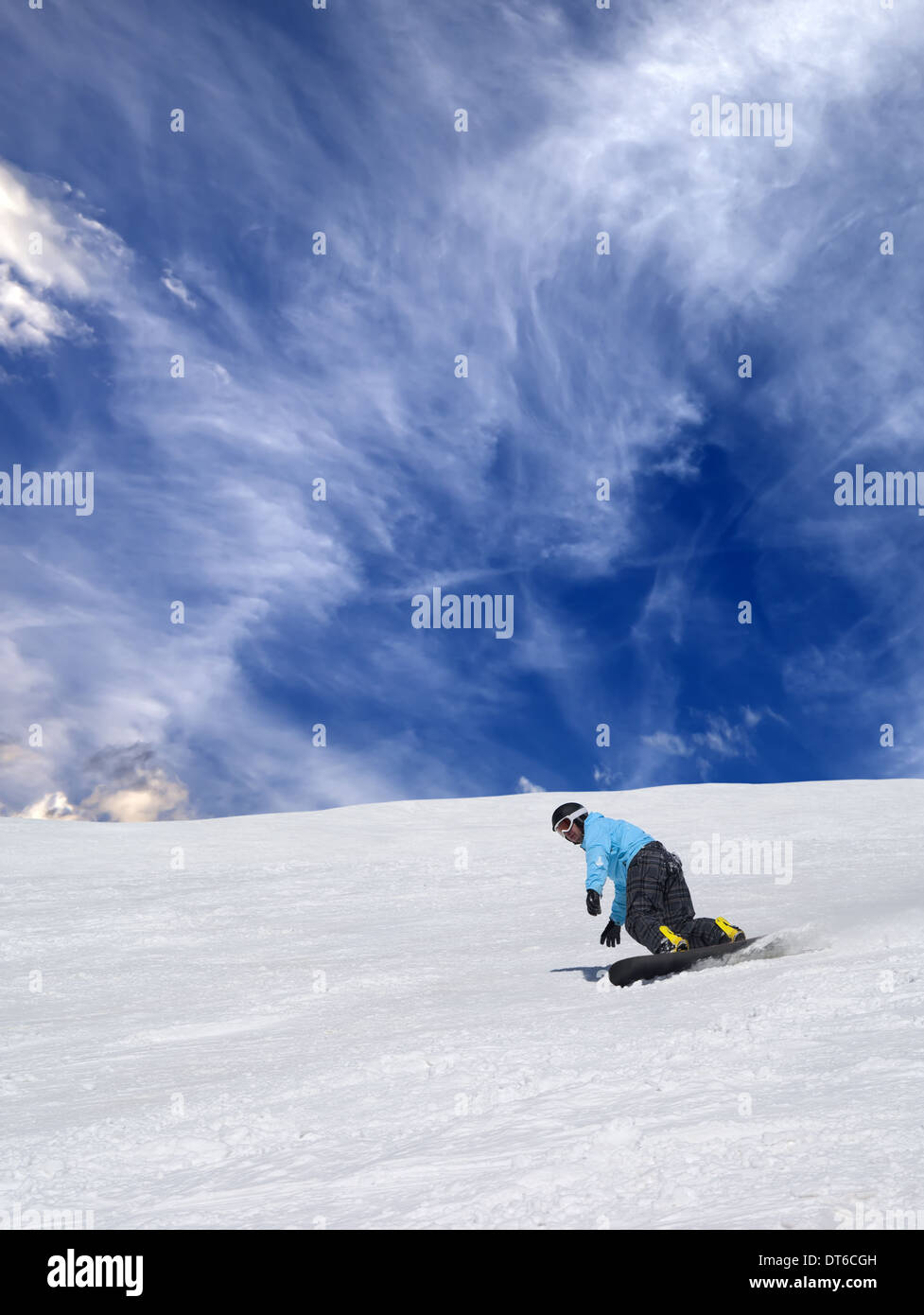 Snowboarder on off-piste slope and sky with clouds Stock Photo - Alamy
