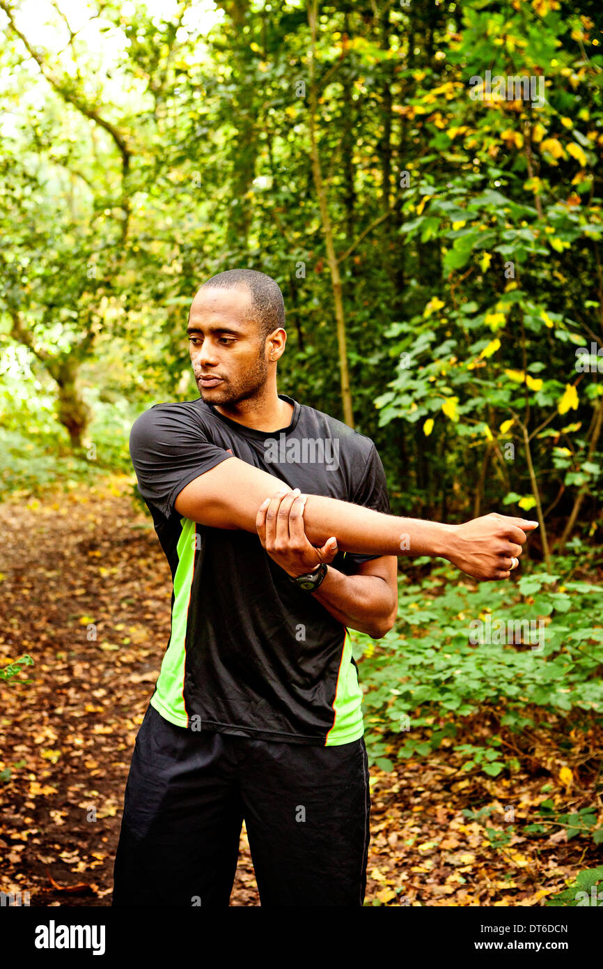 Young man in stretching arms hi-res stock photography and images - Alamy