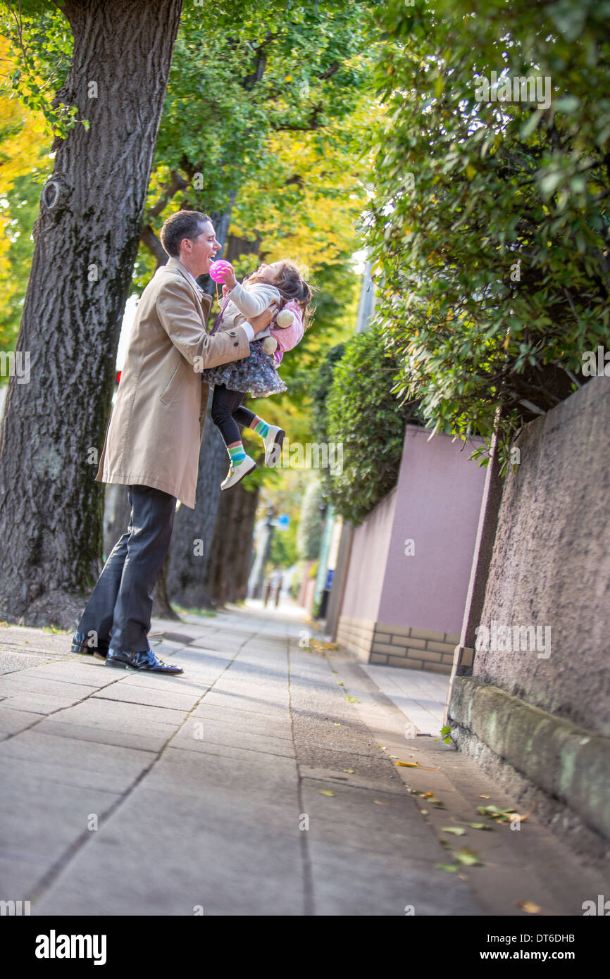 Child lifting arms hi-res stock photography and images - Alamy