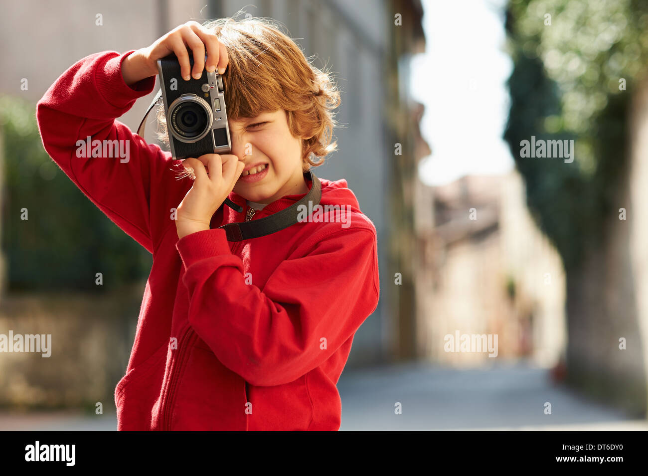 Young boy photographing on street, Province of Venice, Italy Stock ...