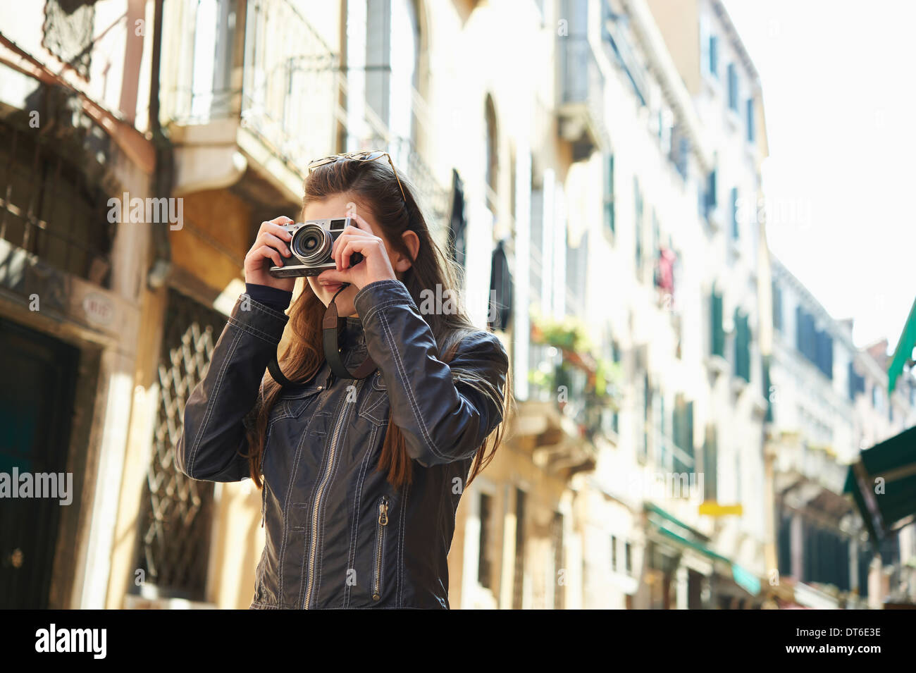Girl taking photographs, Venice, Italy Stock Photo - Alamy