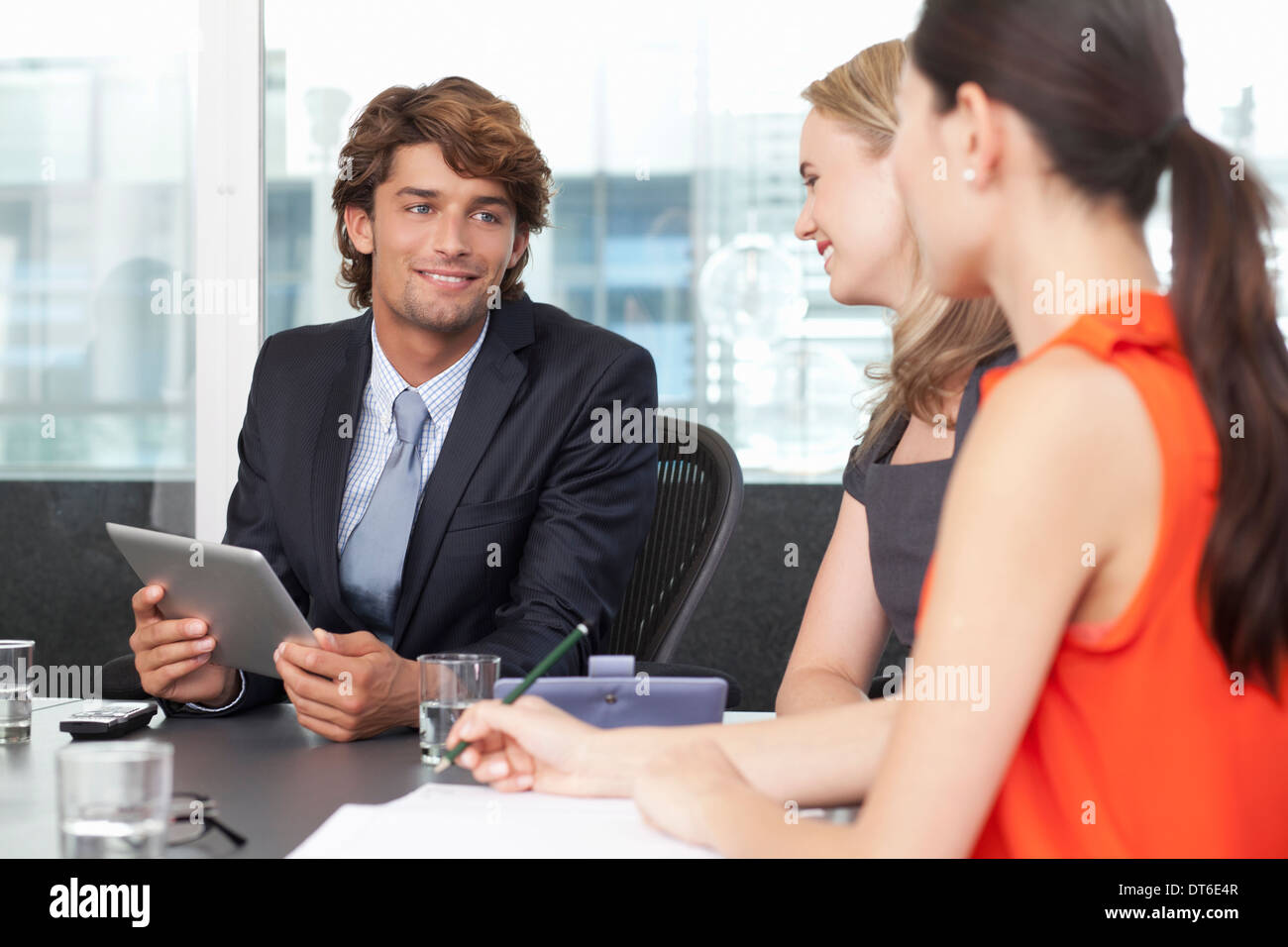 Three colleagues sitting business meeting hi-res stock photography and ...
