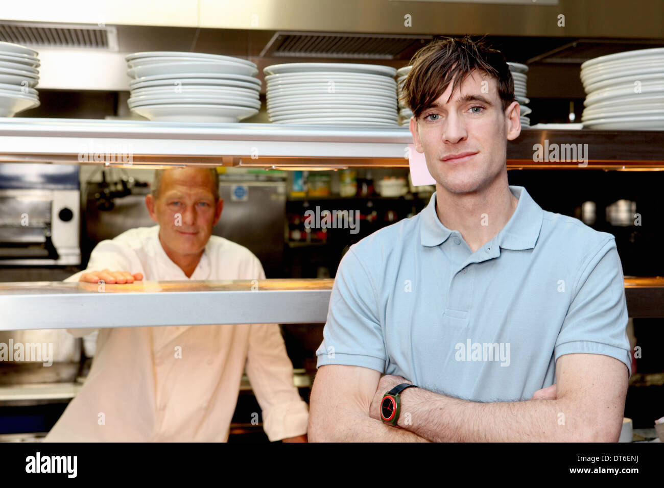Chef and waiter in kitchen Stock Photo - Alamy