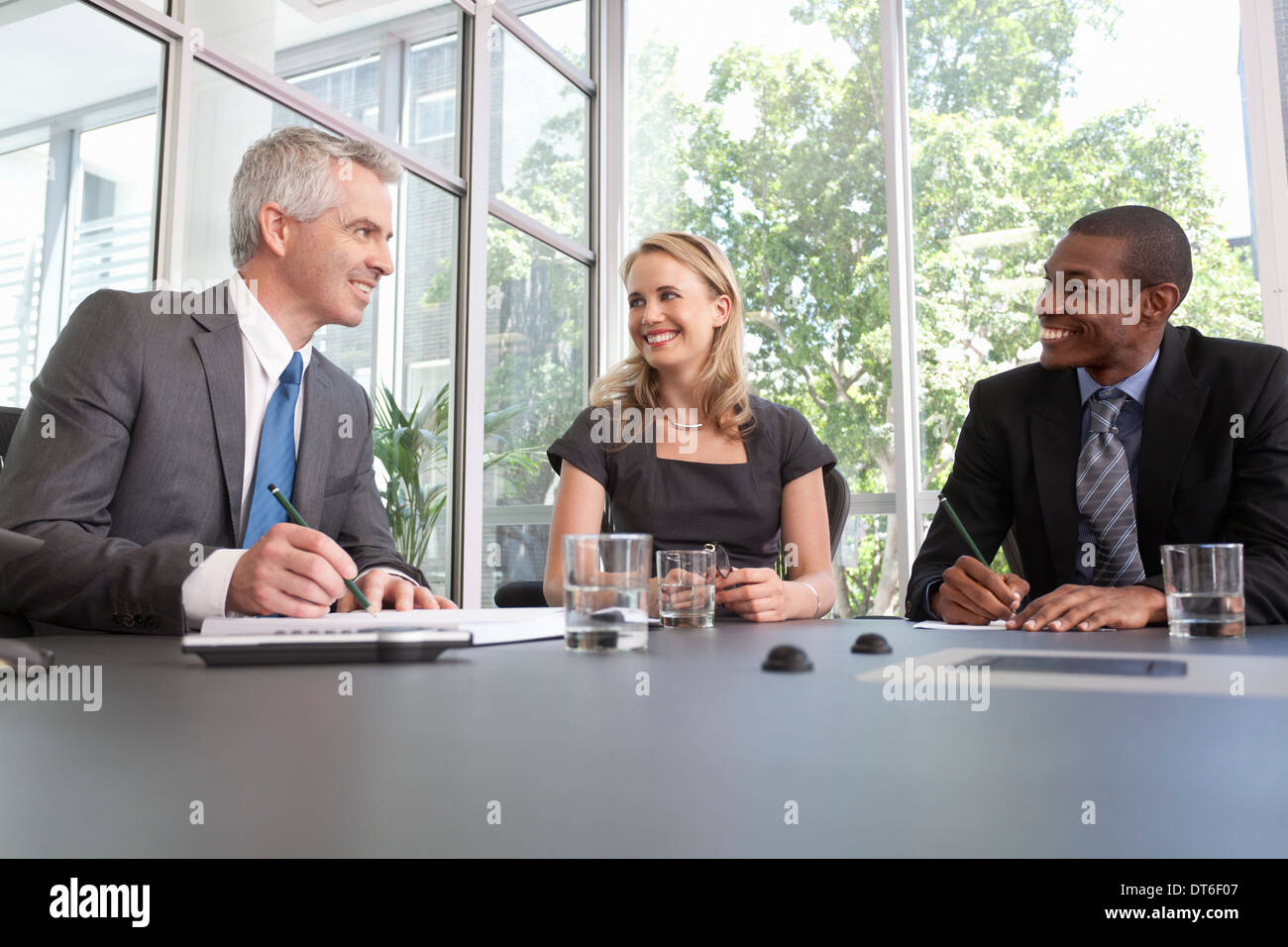 Business manager and team holding meeting in office Stock Photo - Alamy