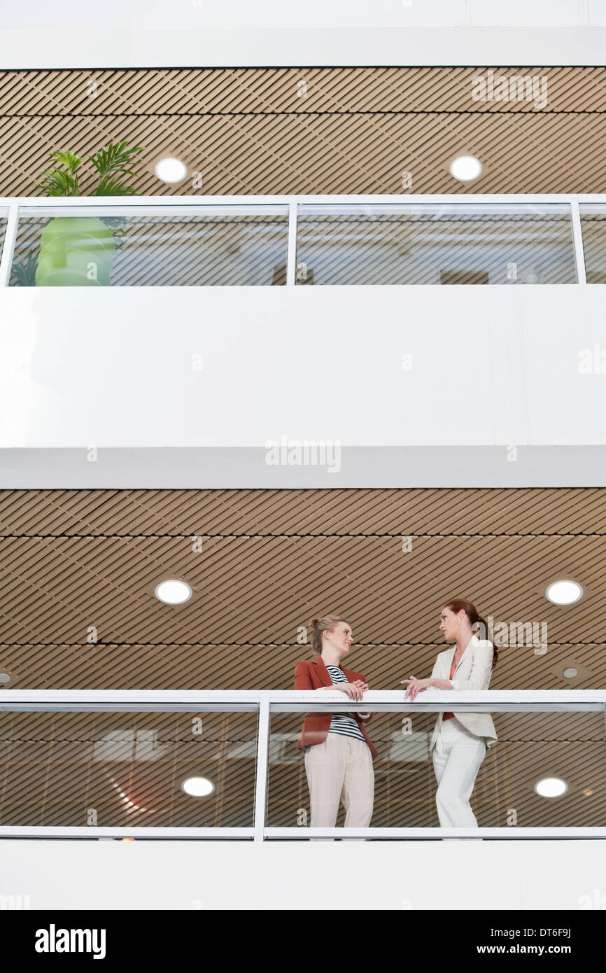 Two people talking on balcony hi-res stock photography and images - Alamy