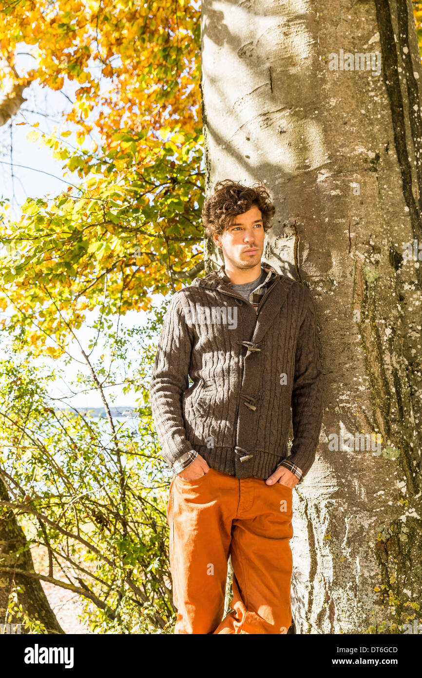 Man leaning against tree hi-res stock photography and images - Alamy