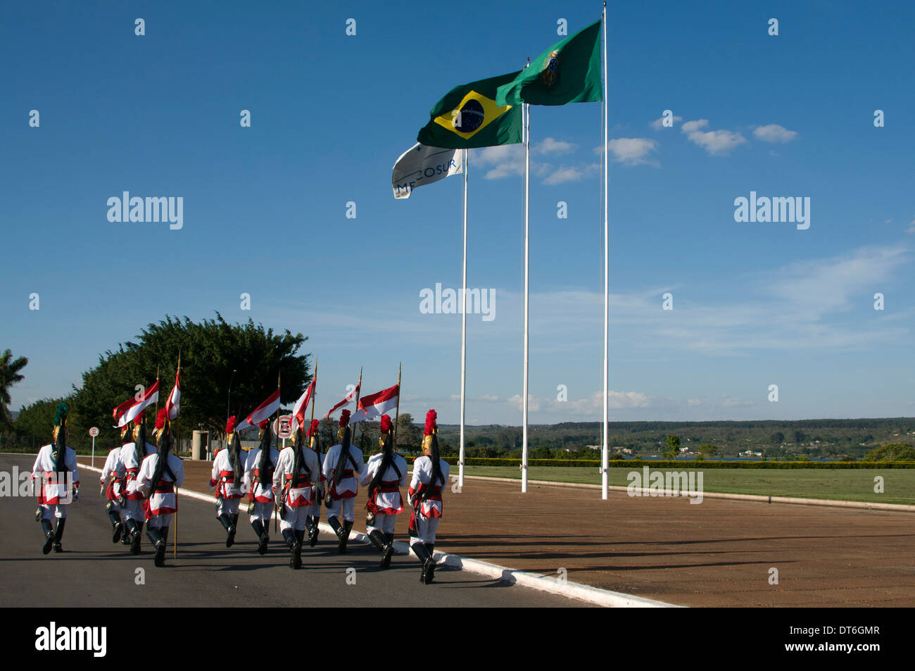 The Presidential Guard in ceremonial uniforms, lower the flags each ...