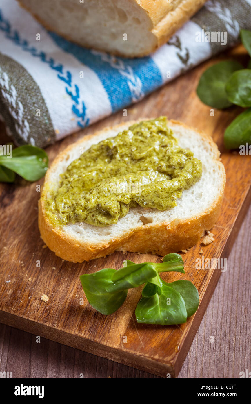 baguette as a snack with fresh pesto and tomatos Stock Photo - Alamy