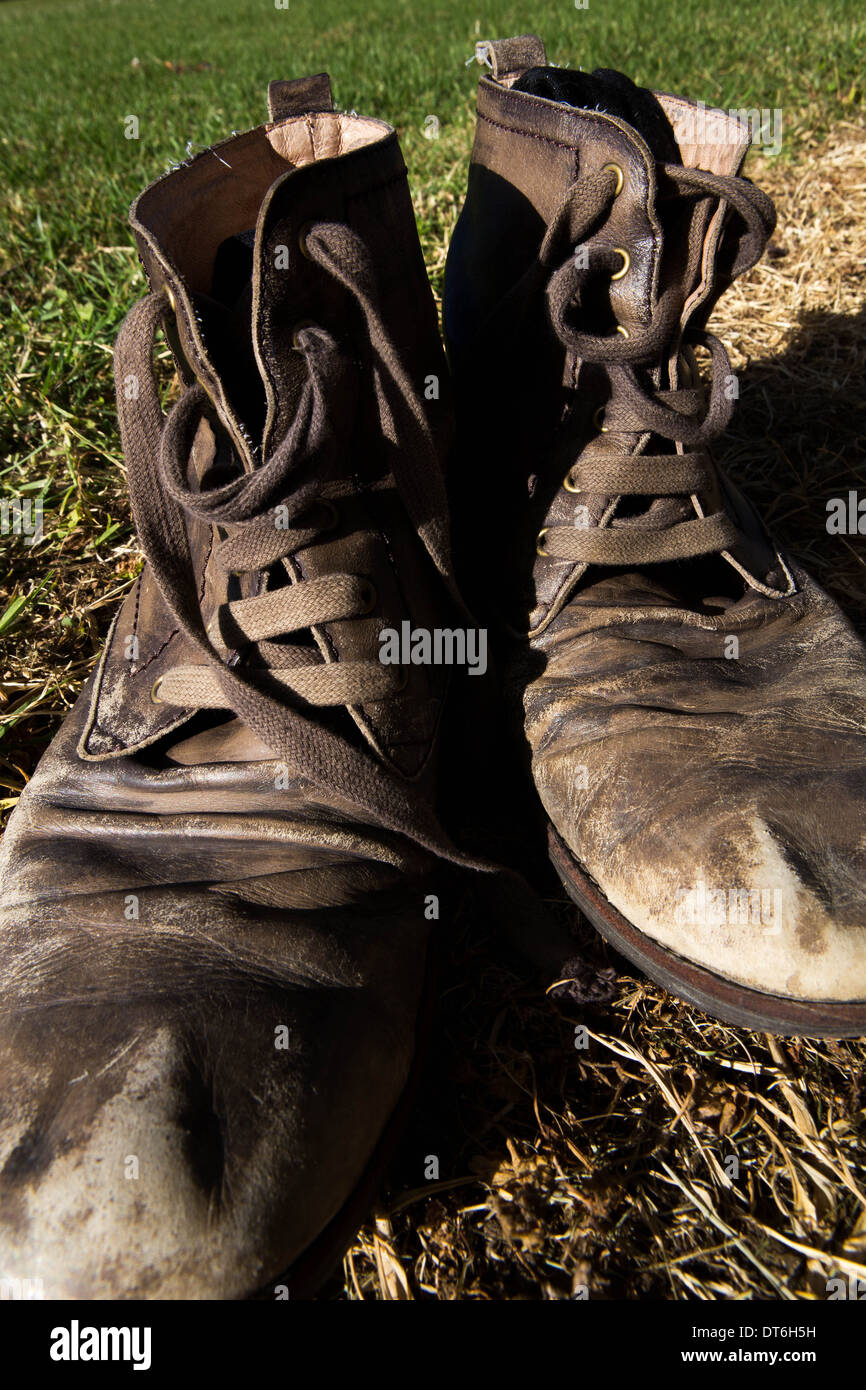 A pair of old boots with laces Stock Photo - Alamy