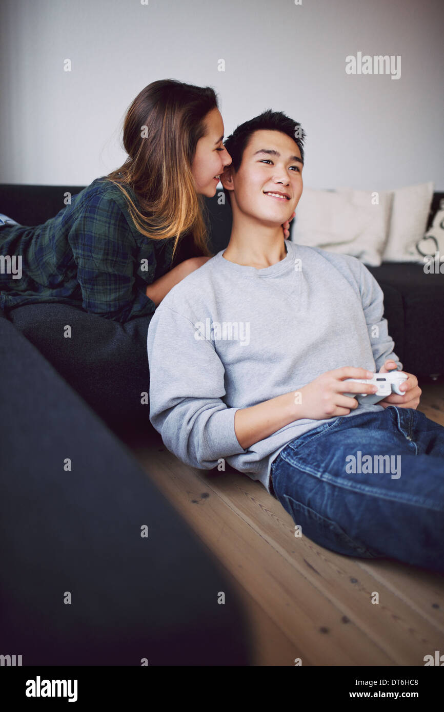 Asian couple whispering ears hi-res stock photography and images - Alamy