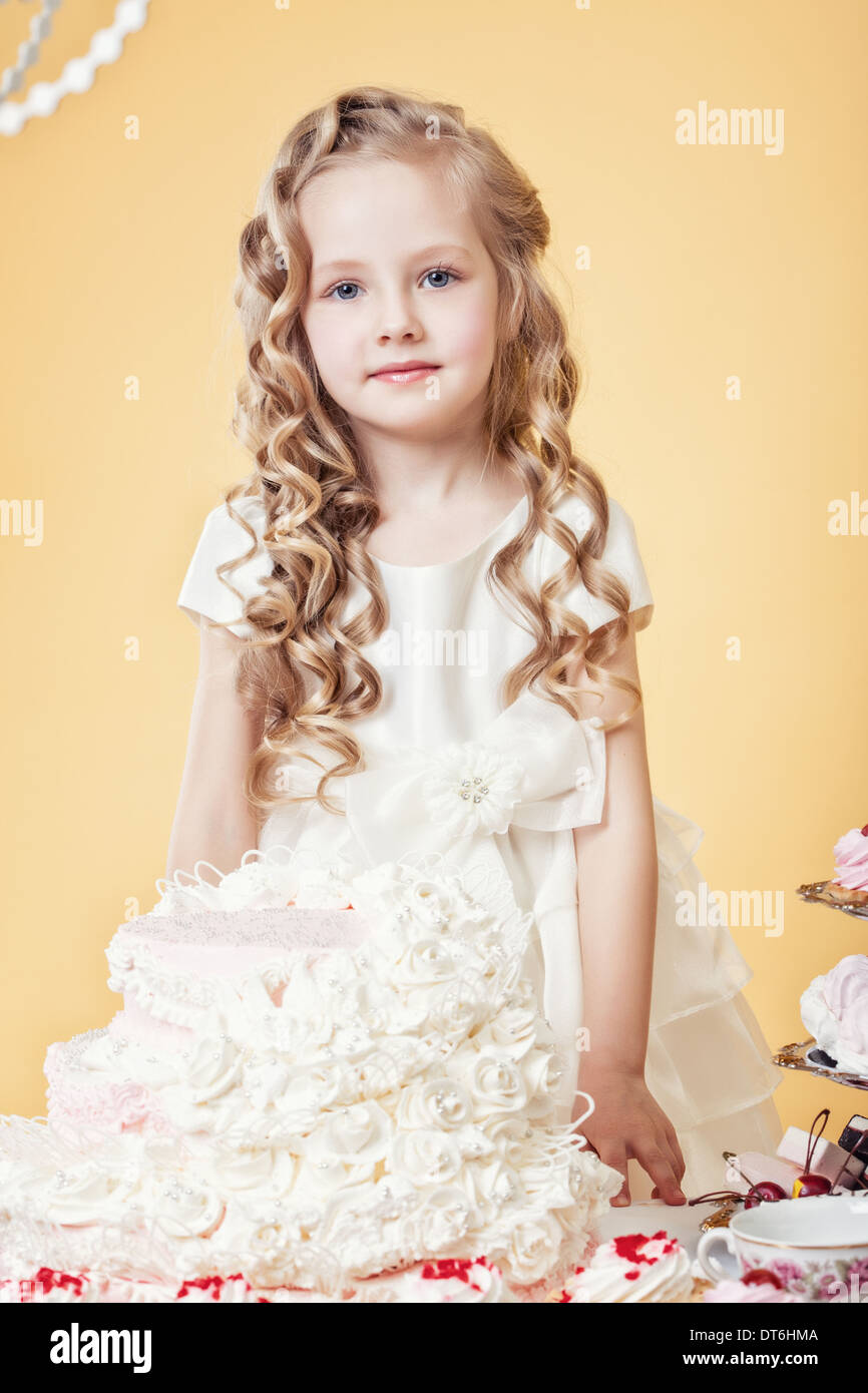 Smiling birthday girl posing with tasty cake Stock Photo - Alamy