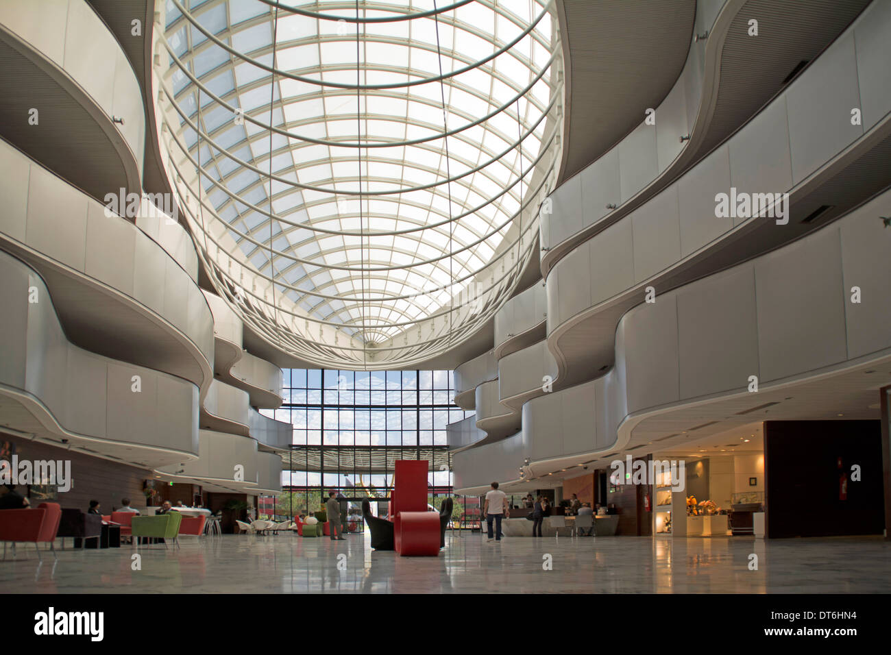 A large glass skylight in the shape of a boat hull above the reception ...