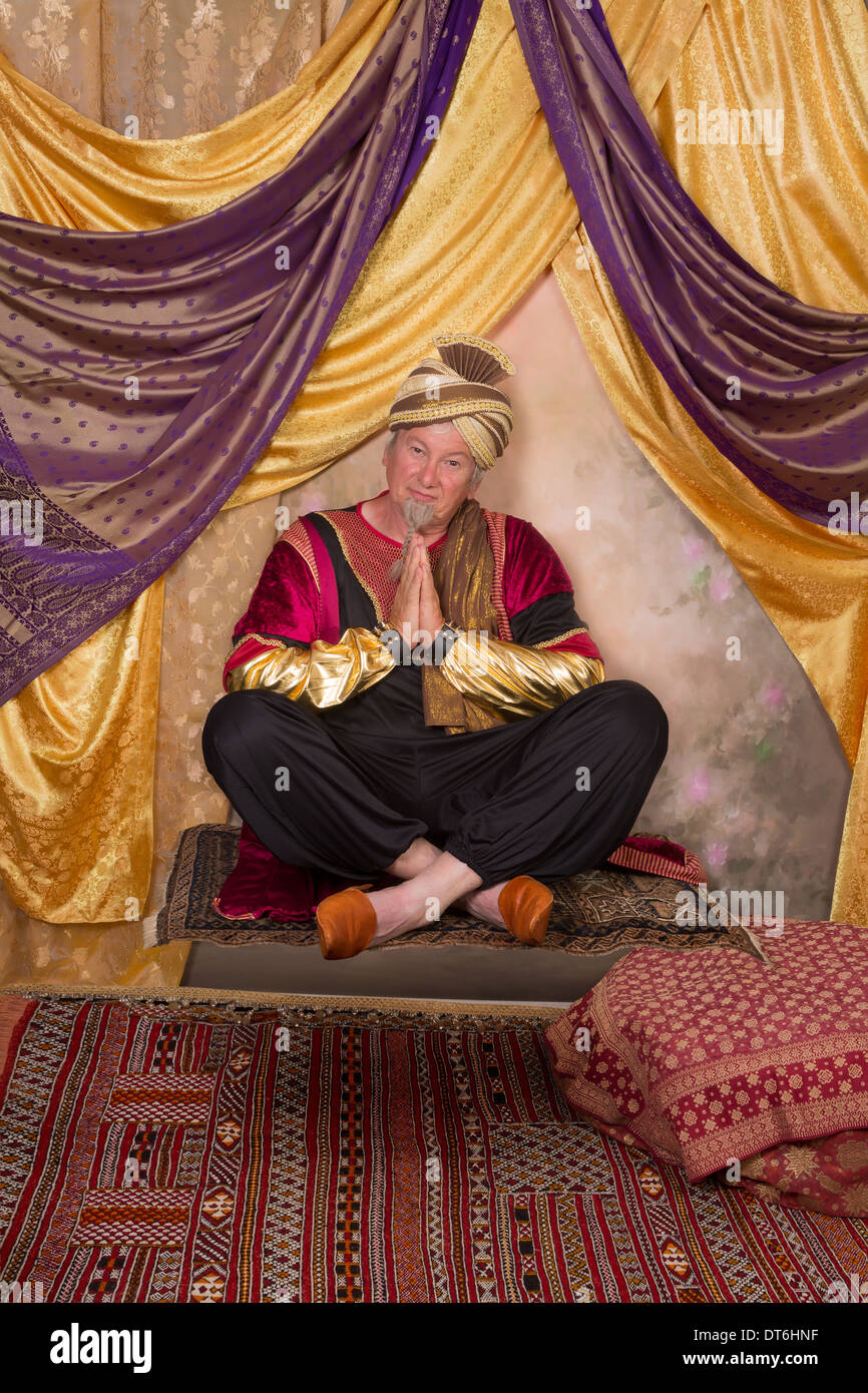 Sultan character greeting while sitting on a flying carpet Stock Photo ...
