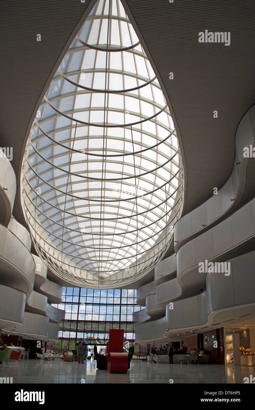 A large glass skylight in the shape of a boat hull above the reception ...