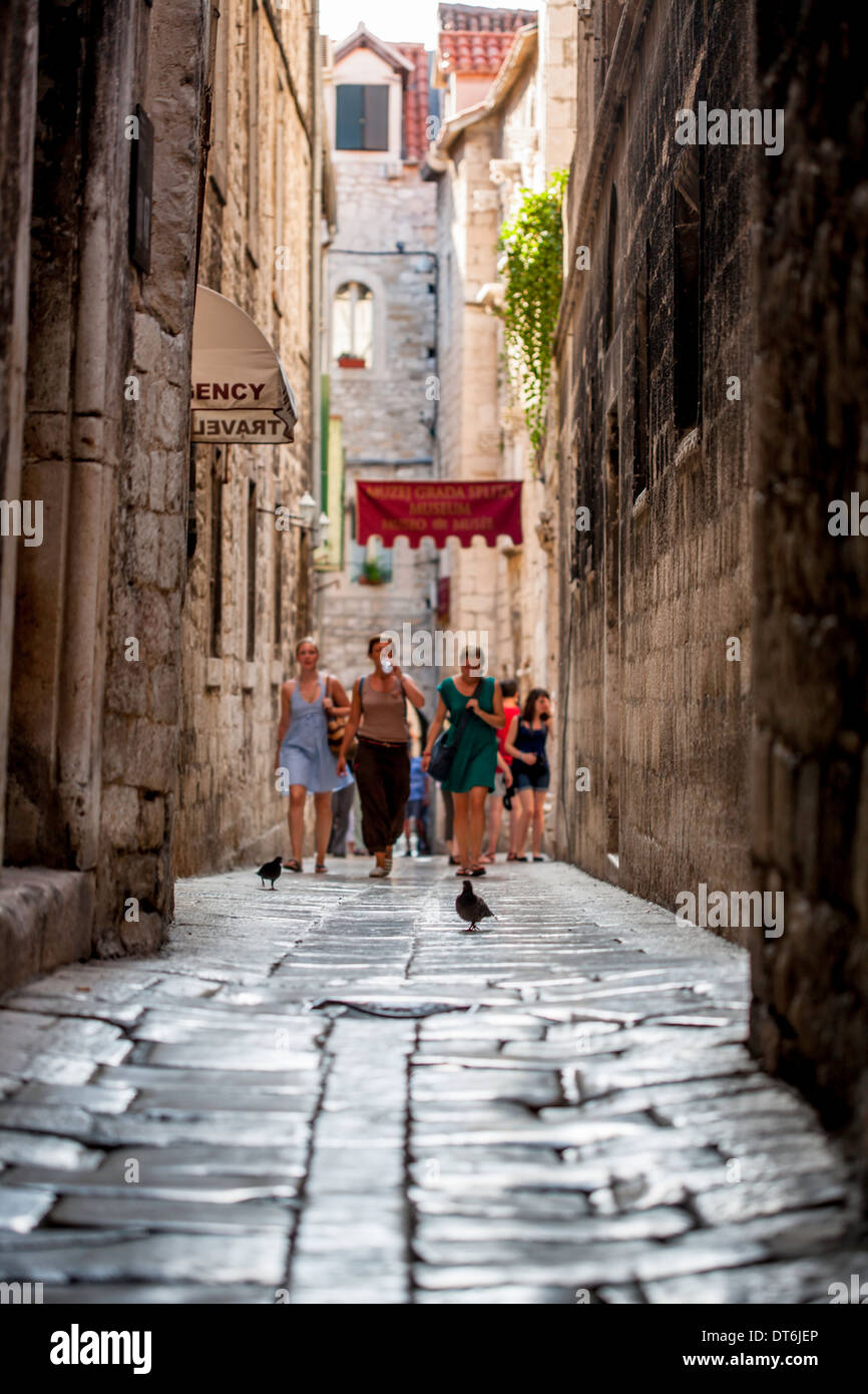 Narrow street in the city Stock Photo - Alamy