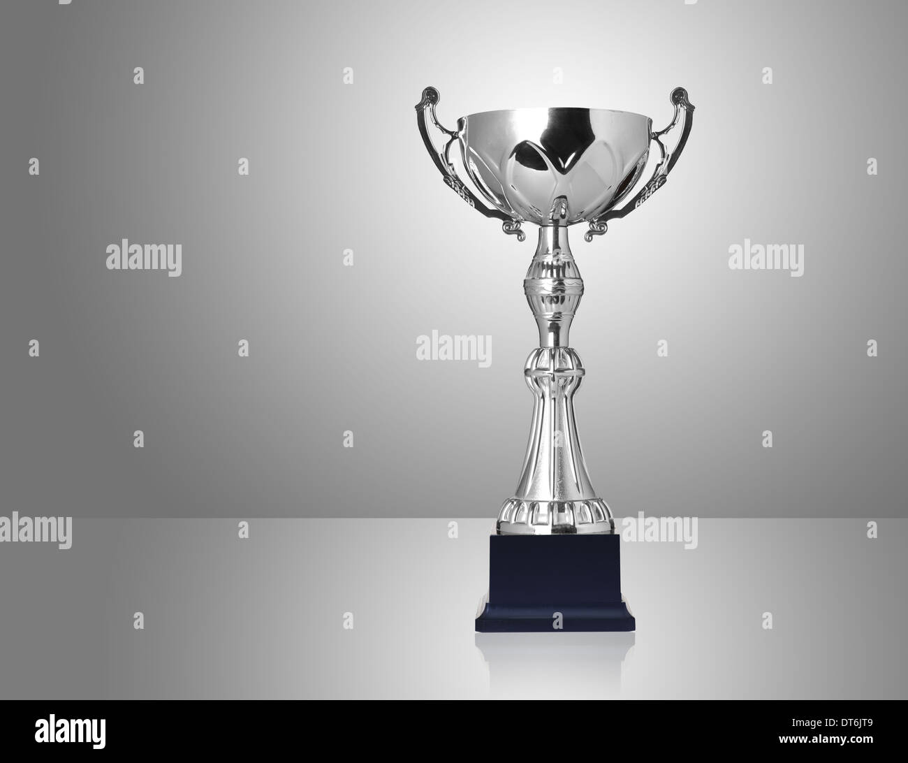 champion silver trophy on grey background Stock Photo - Alamy
