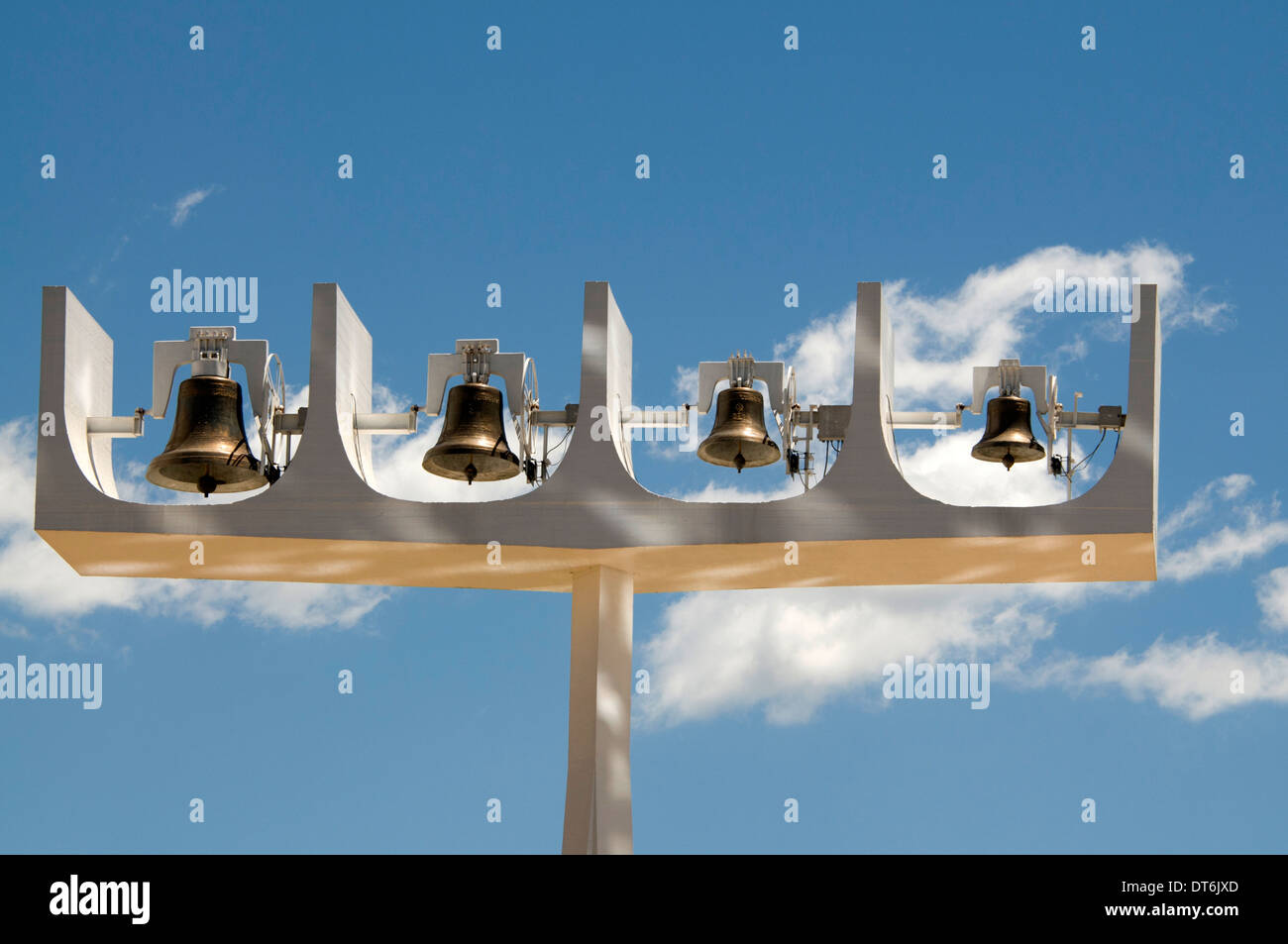 A 20-meter (66 ft) tall bell tower containing four large bells beside ...