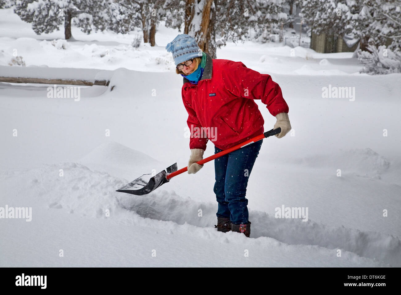 Woman Shoveling Snow