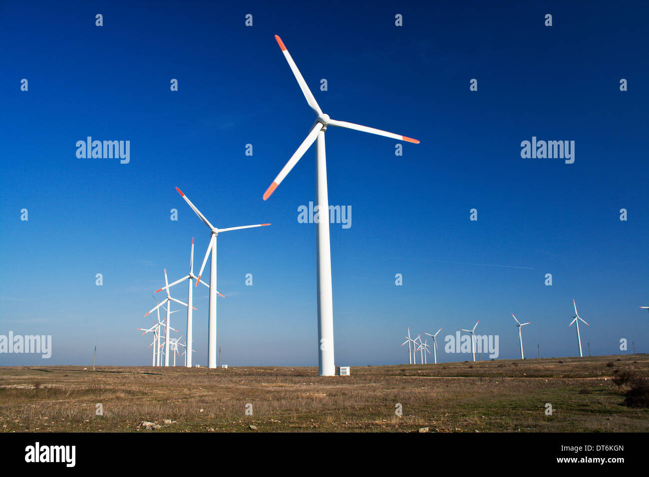 Wind power generators with blue clear sky Stock Photo - Alamy