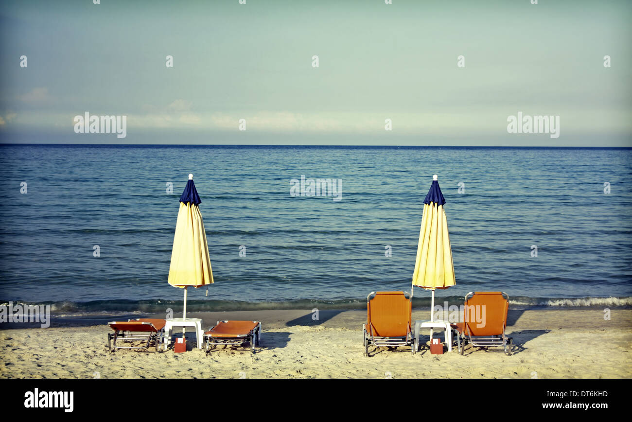 Vintage photo of sunbeds and umbrellas on the beach Stock Photo - Alamy