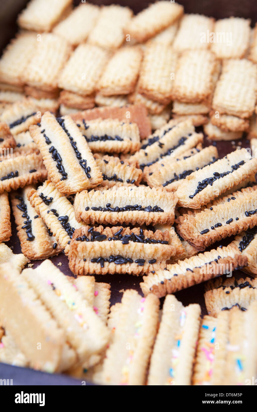 Lots of freshly baked cookies piled up while cooling off Stock Photo ...