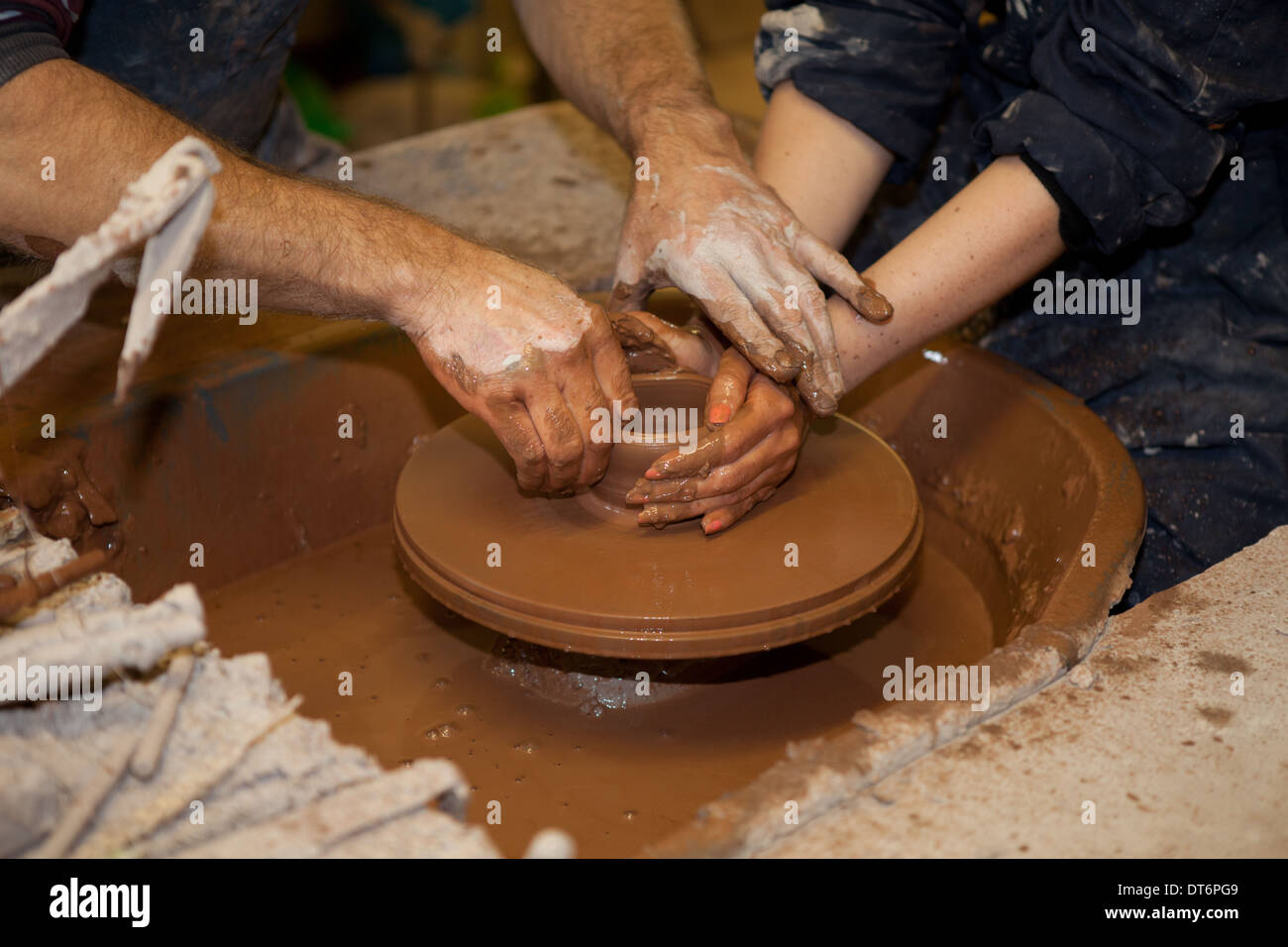 Creating a pot on a potters wheel Stock Photo - Alamy