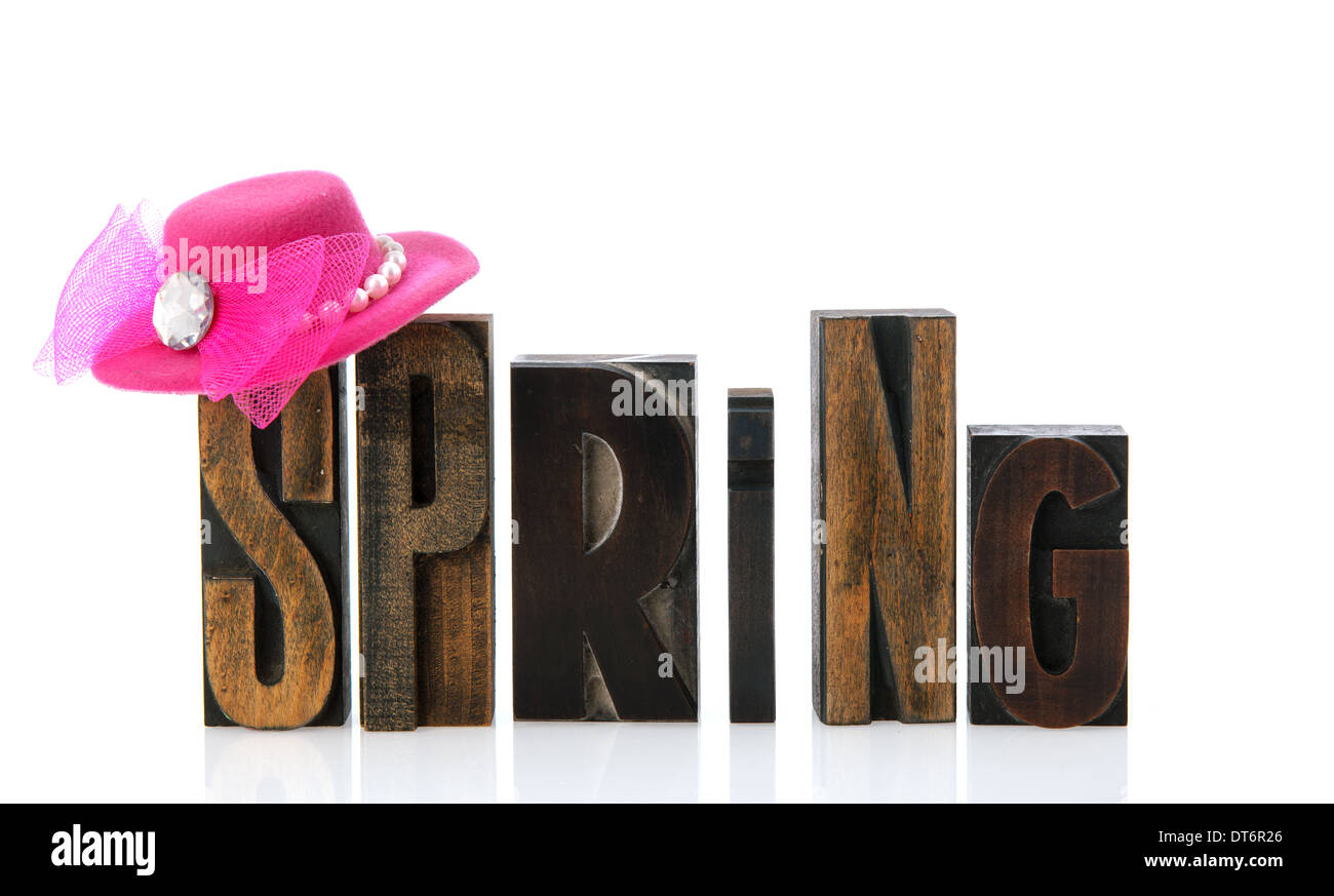 spring in vintage print letters with pink hat Stock Photo - Alamy