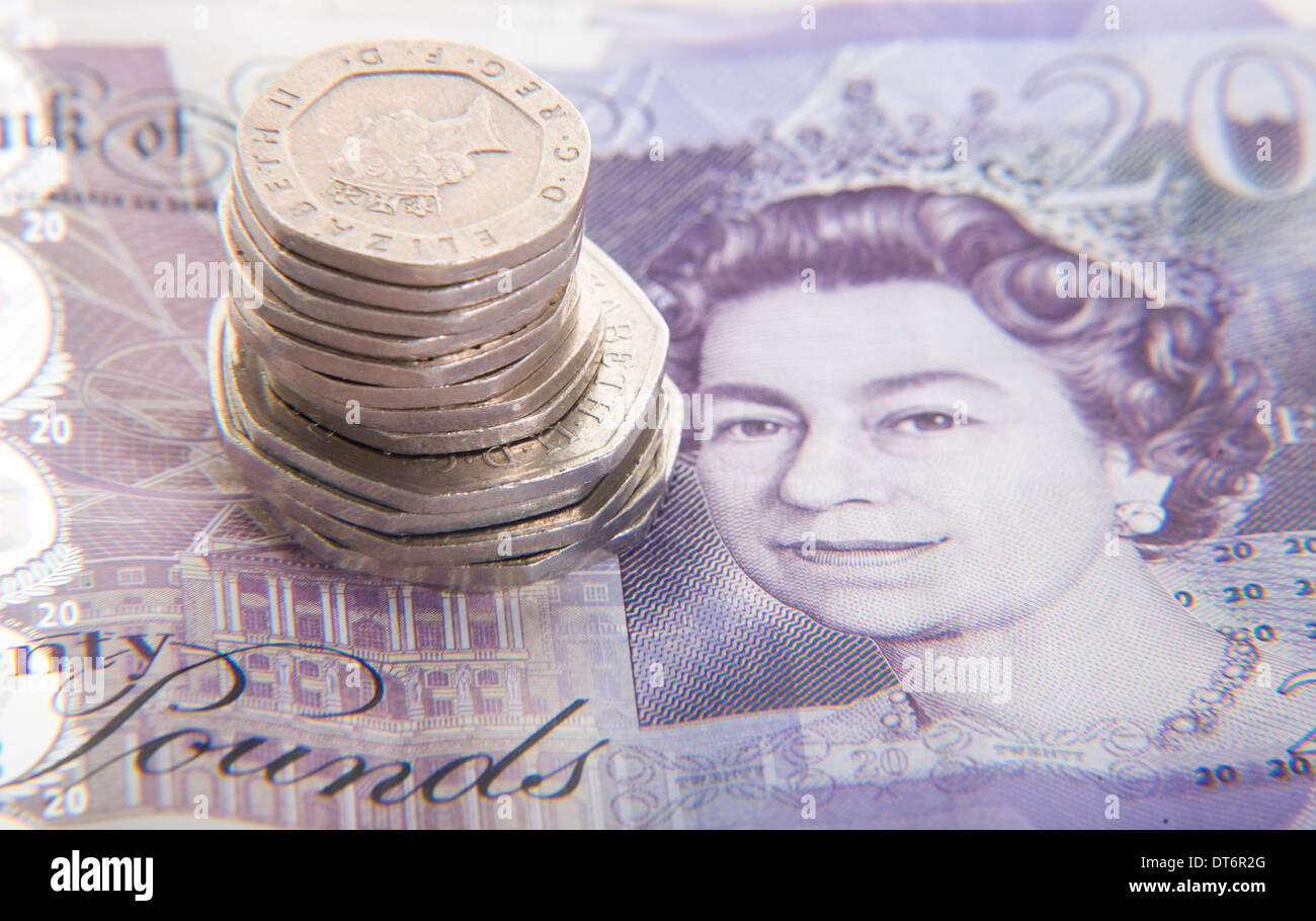 £20 note and stack of UK Silver Coins Stock Photo - Alamy