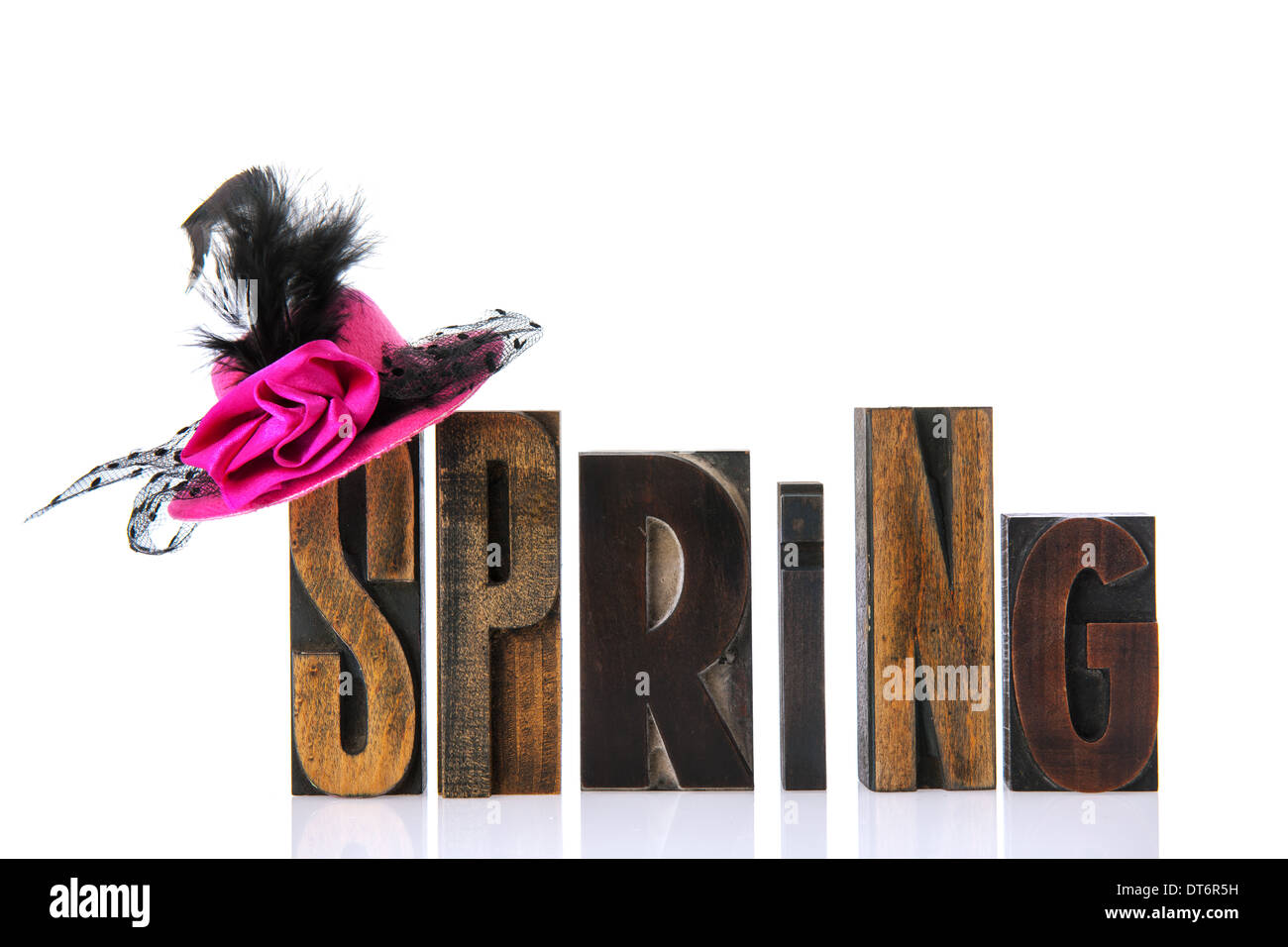 spring in vintage print letters with pink hat Stock Photo - Alamy