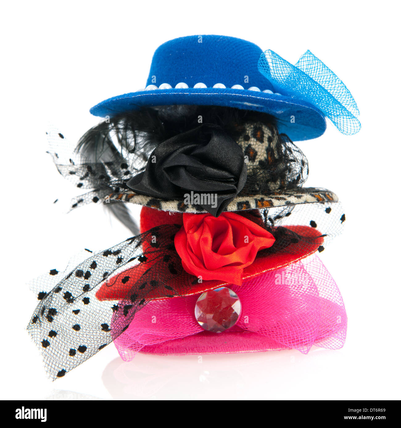 Stacked female hats isolated over white background Stock Photo - Alamy