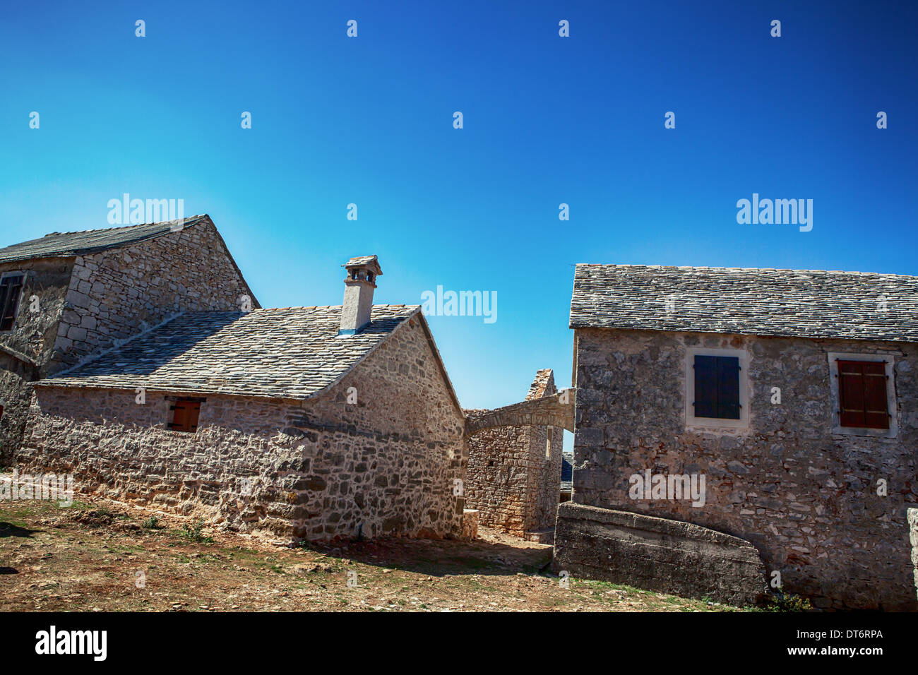 old stone rustic house and blue summer sky Stock Photo - Alamy