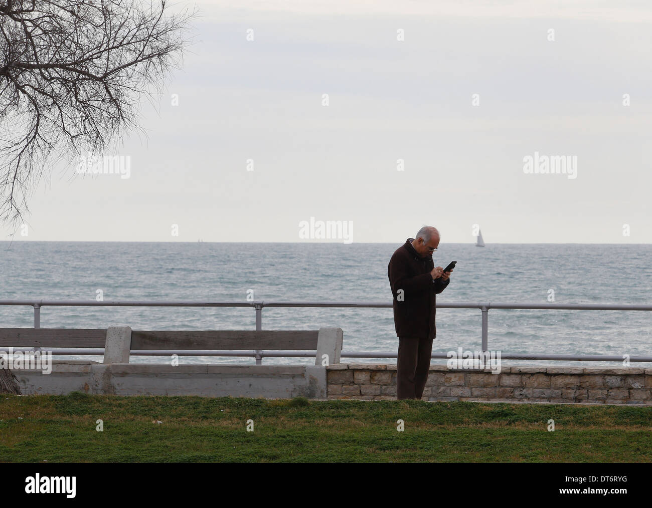 Man standing on seaside promenade hi-res stock photography and images ...