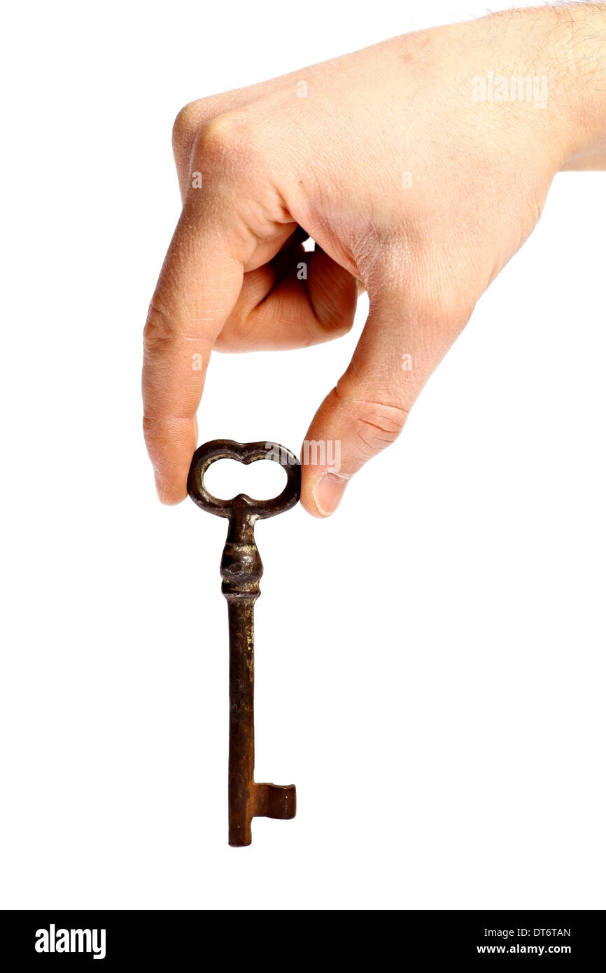 Hand holding an old rusty key isolated on white background Stock Photo ...